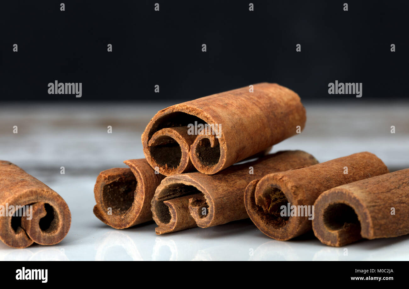 Cassia cinnamon sticks macro with free space for text Stock Photo - Alamy