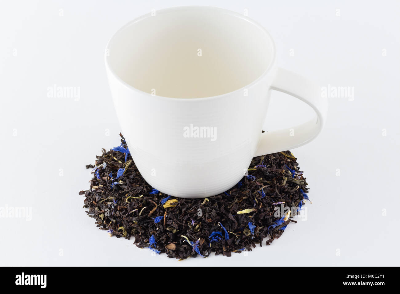 cup of tea with fresh organic tea leaves isolated on white background ...