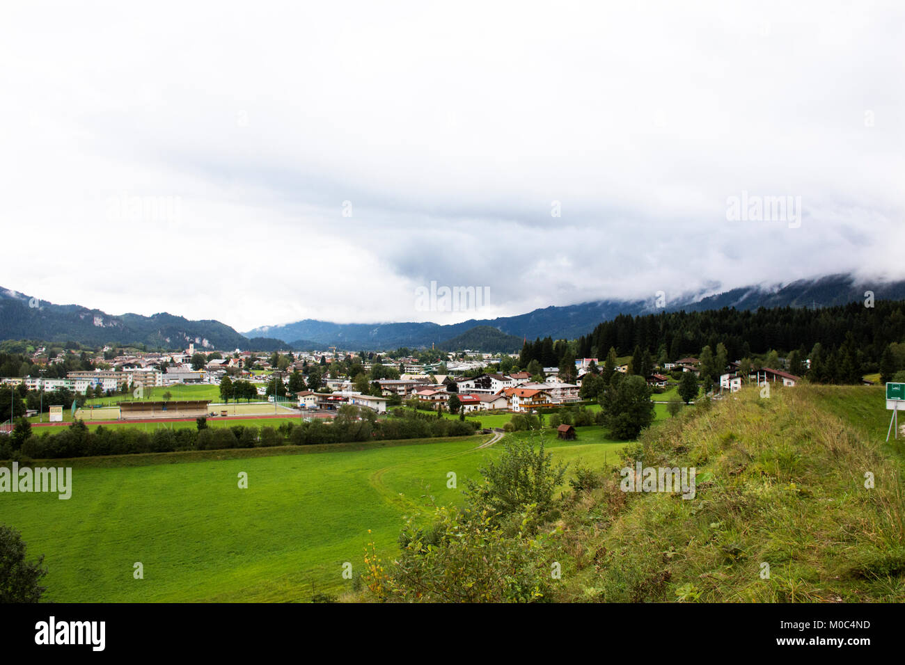 View landscape of alps mountain and cityscape of Reutte city is a ...