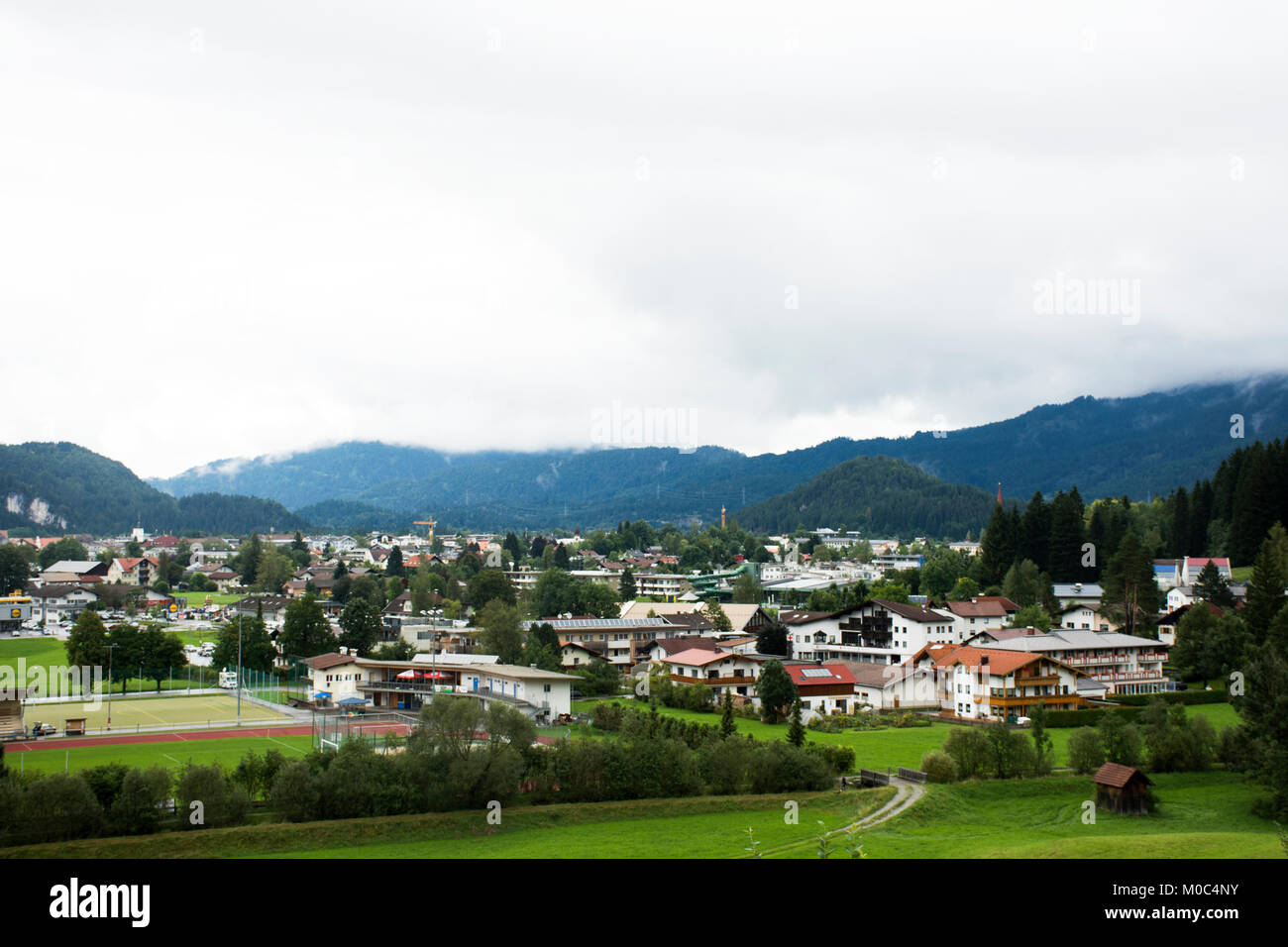 View landscape of alps mountain and cityscape of Reutte city is a ...