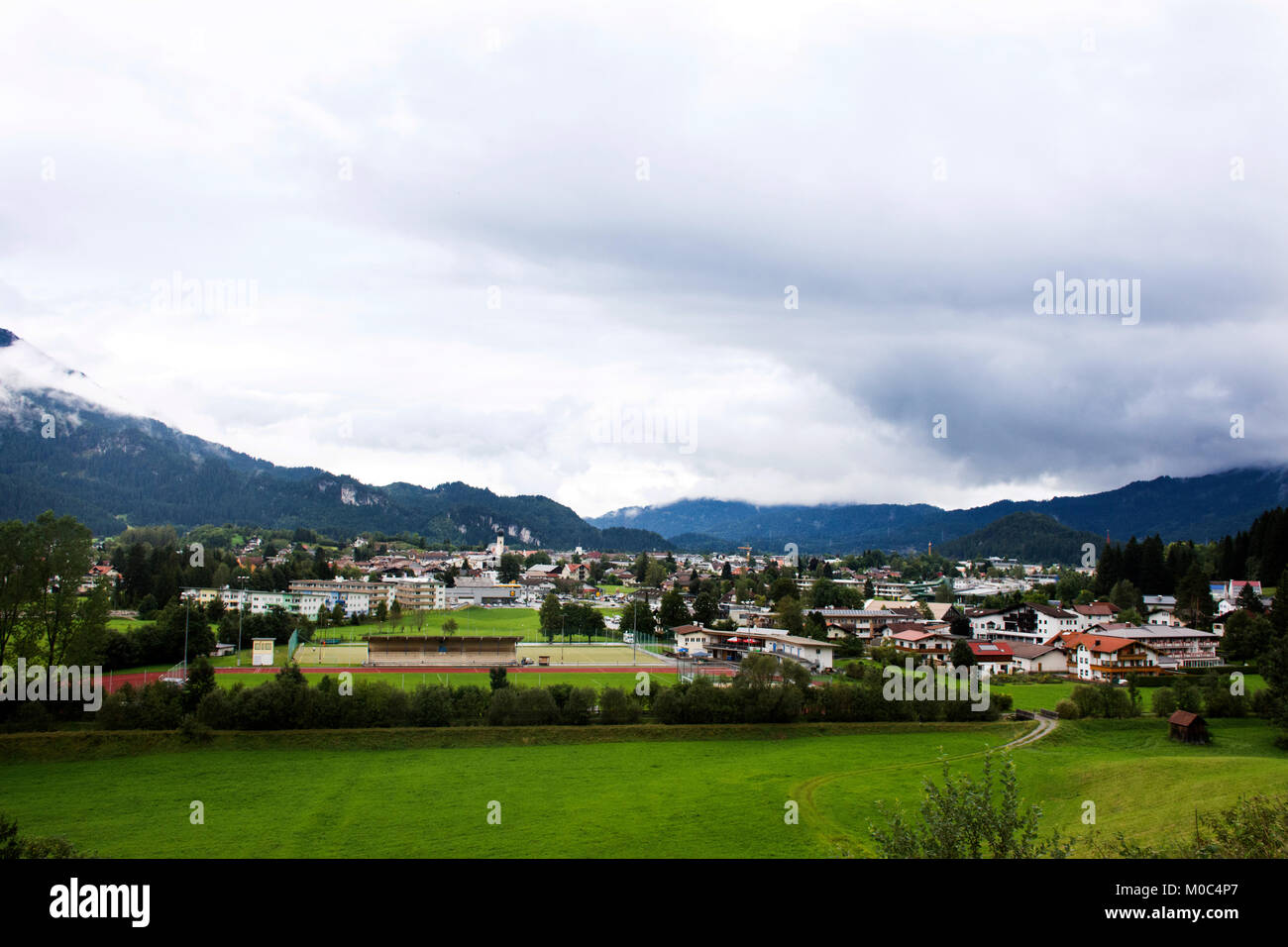 View landscape of alps mountain and cityscape of Reutte city is a ...
