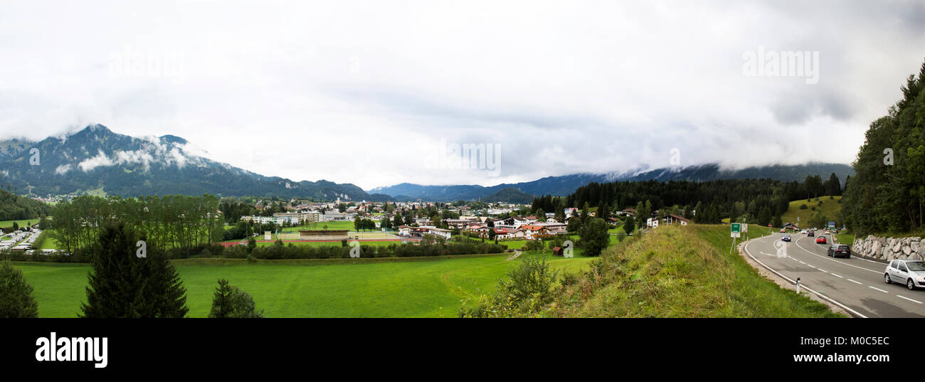 Traffic road with view landscape of alpine and cityscape of Reutte city ...