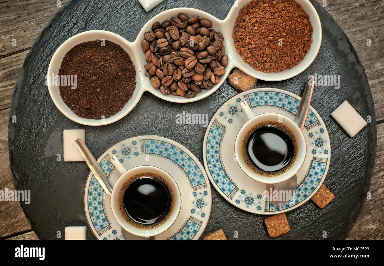 Drinks, drinking, energy and caffeine concept-two cups of coffee ...