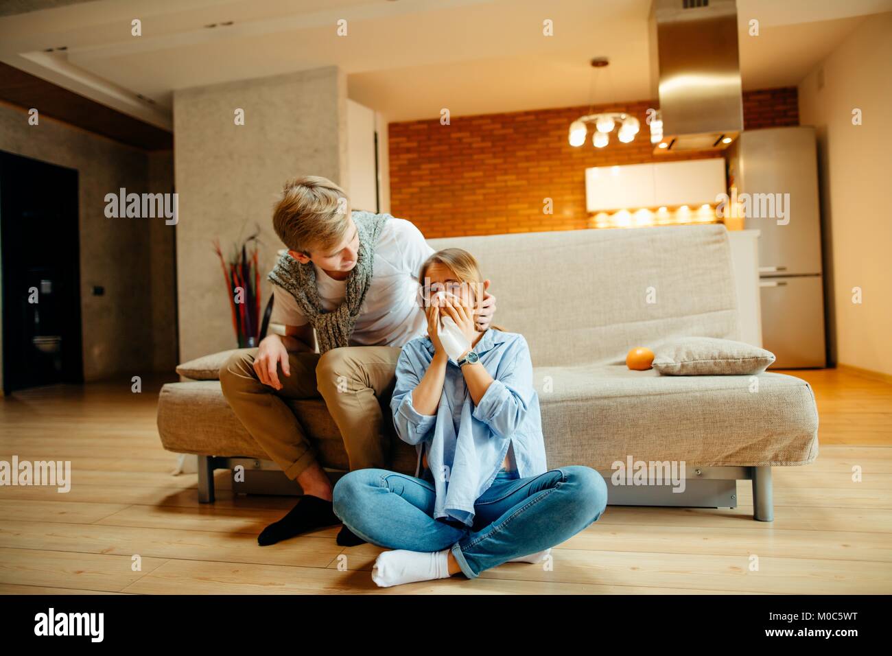 couple watching sad movie, woman cry Stock Photo - Alamy