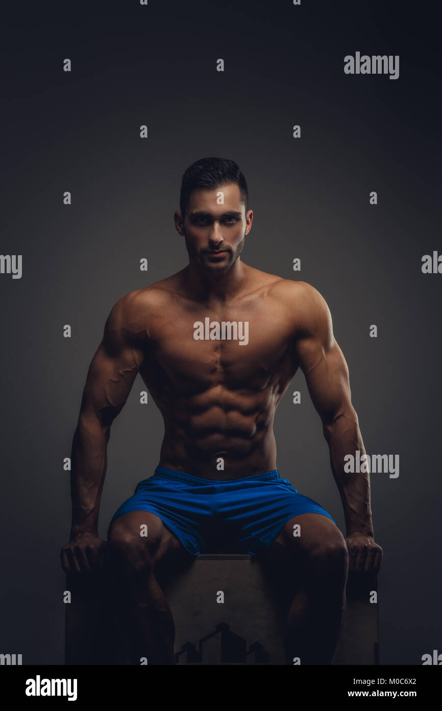 Shirtless muscular man in a blue shorts Stock Photo - Alamy