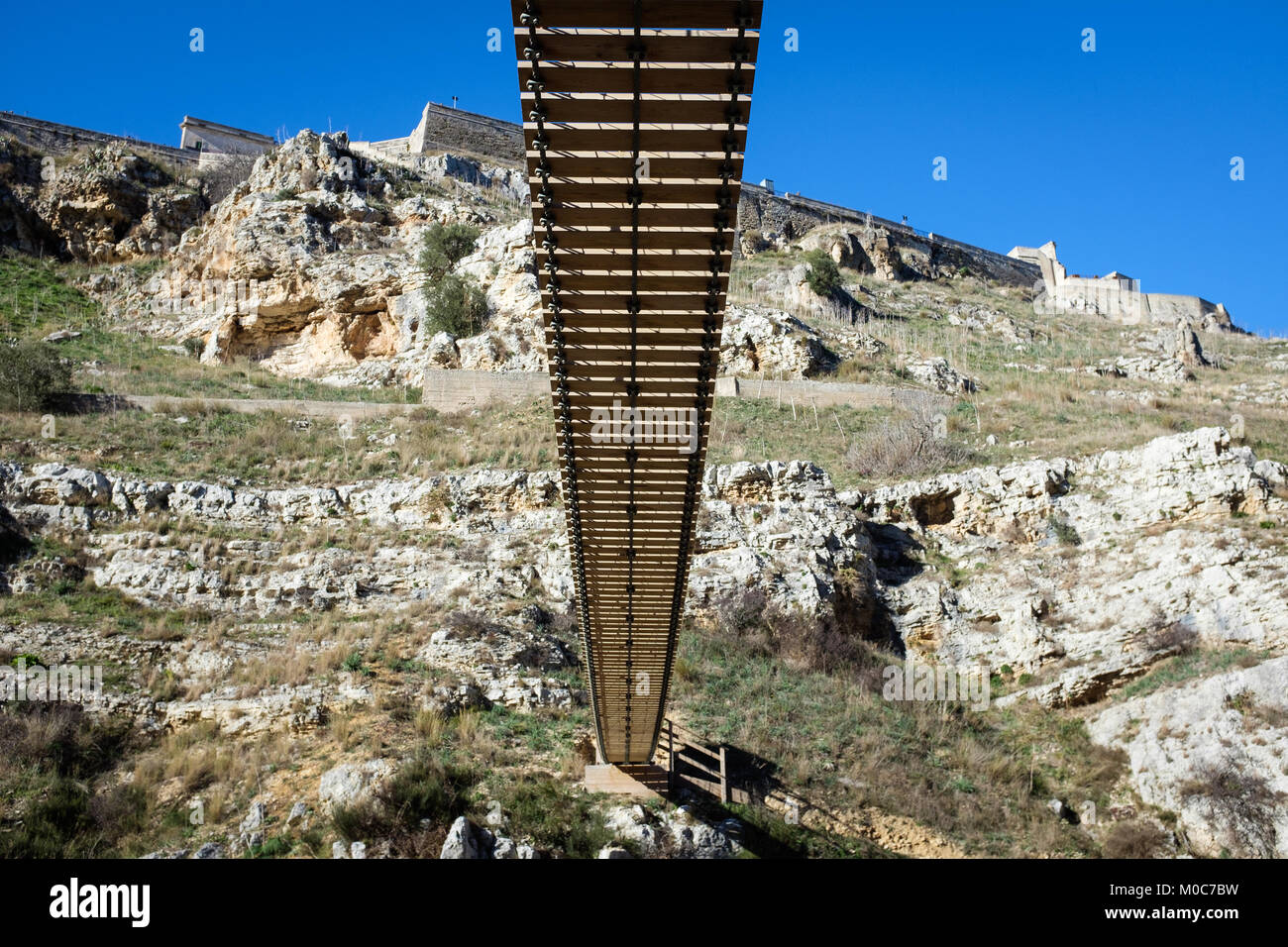 Bottom view of the rope bridge of Matera canyon. Italy Stock Photo - Alamy