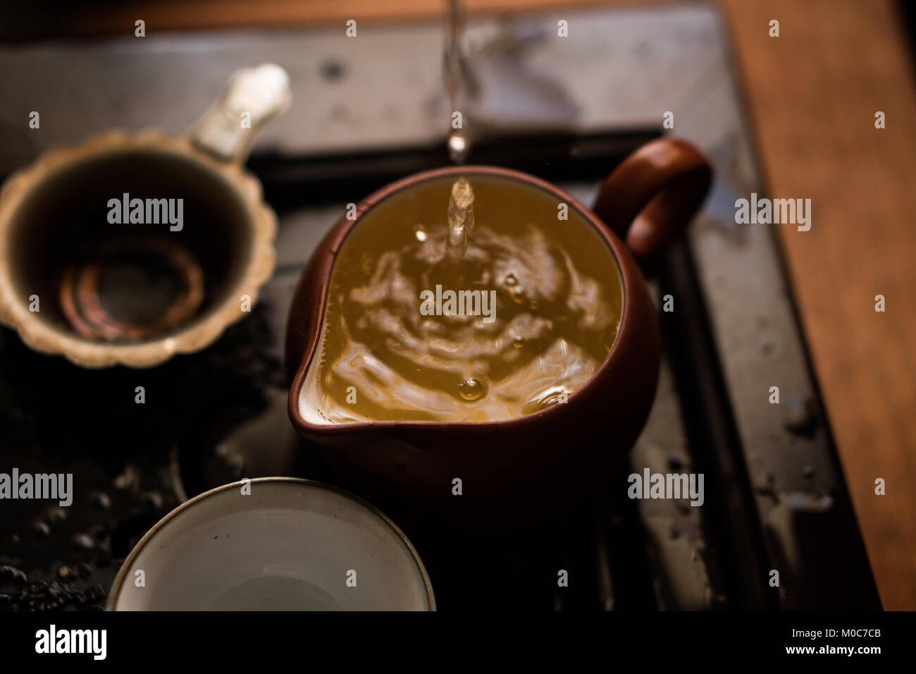 Green Tea Pouring in Traditional Chinese Tea Ceremony Stock Photo - Alamy