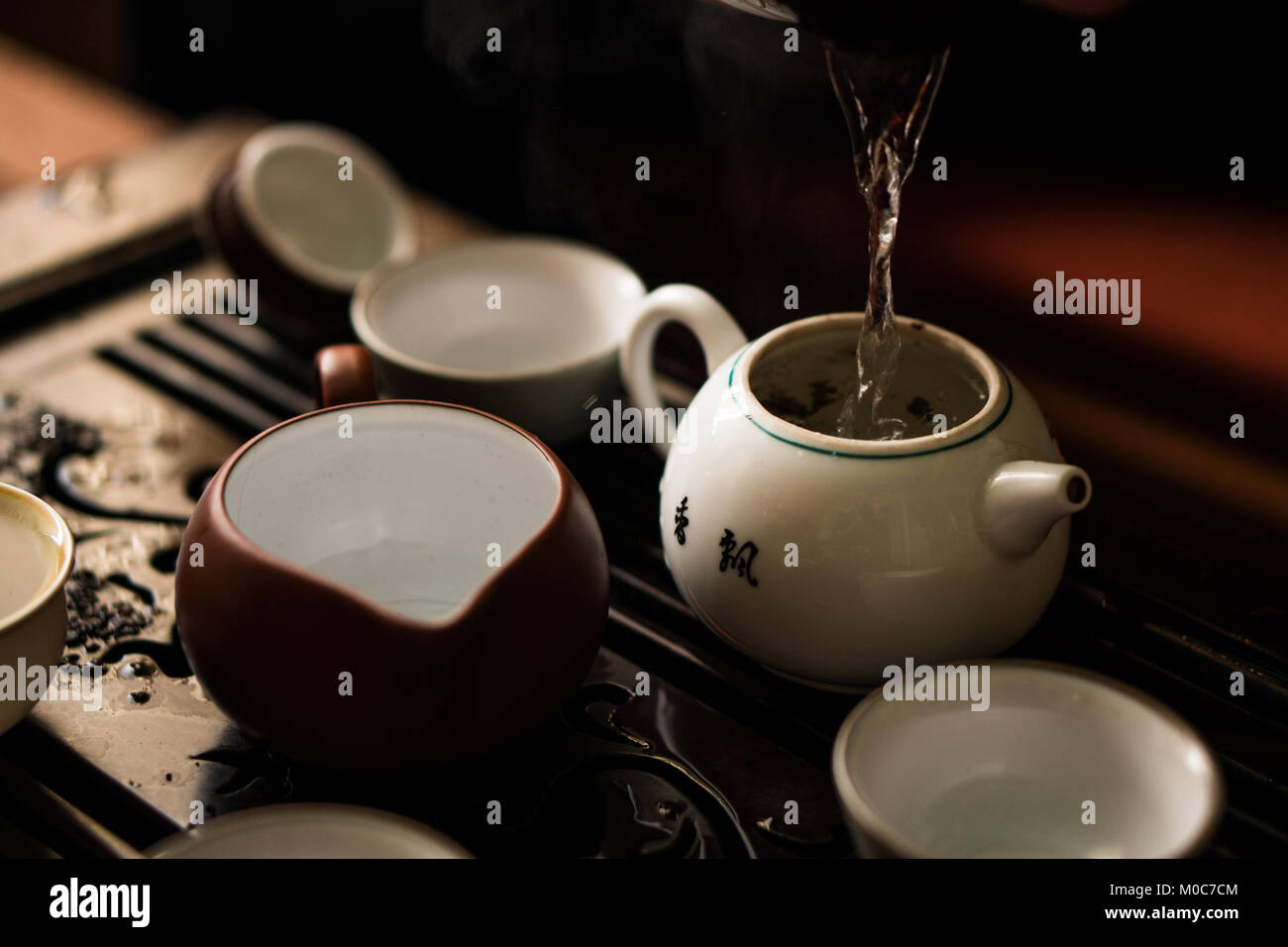 Green Tea Pouring in Traditional Chinese Tea Ceremony Stock Photo - Alamy