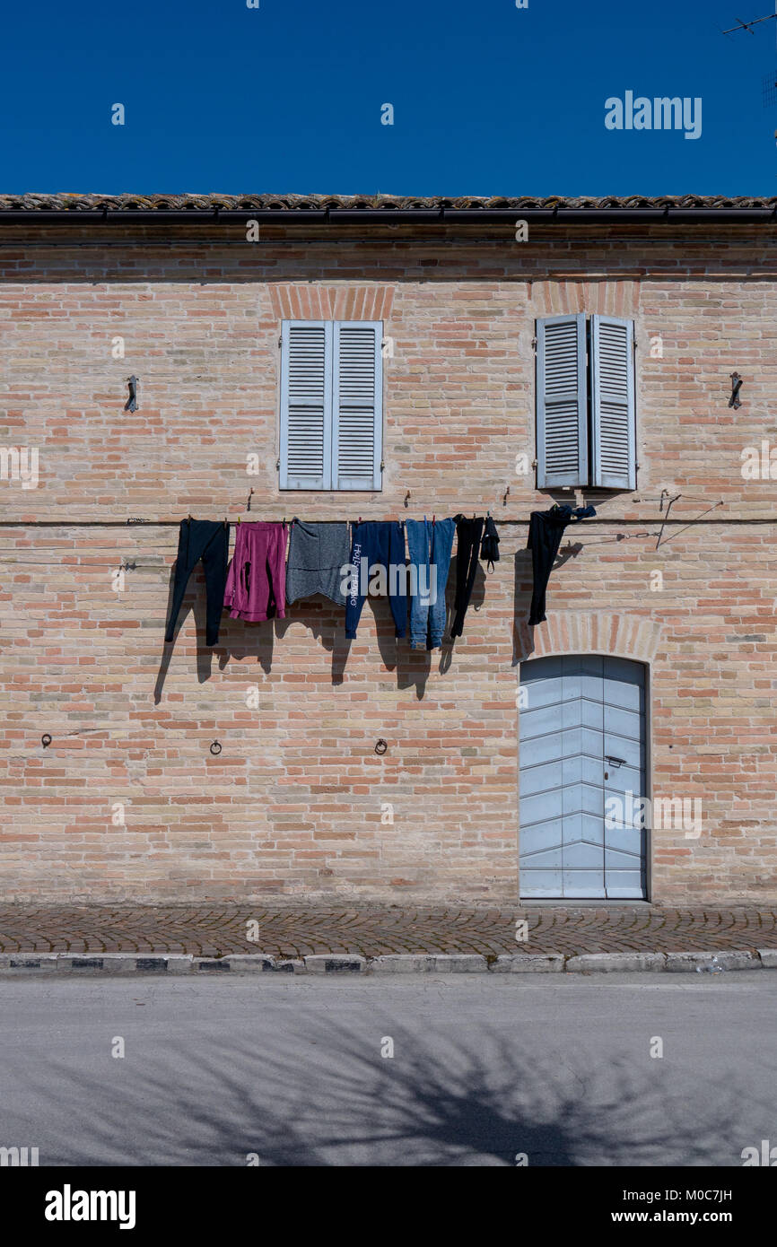 Clothes hanging from a clothes line Stock Photo - Alamy