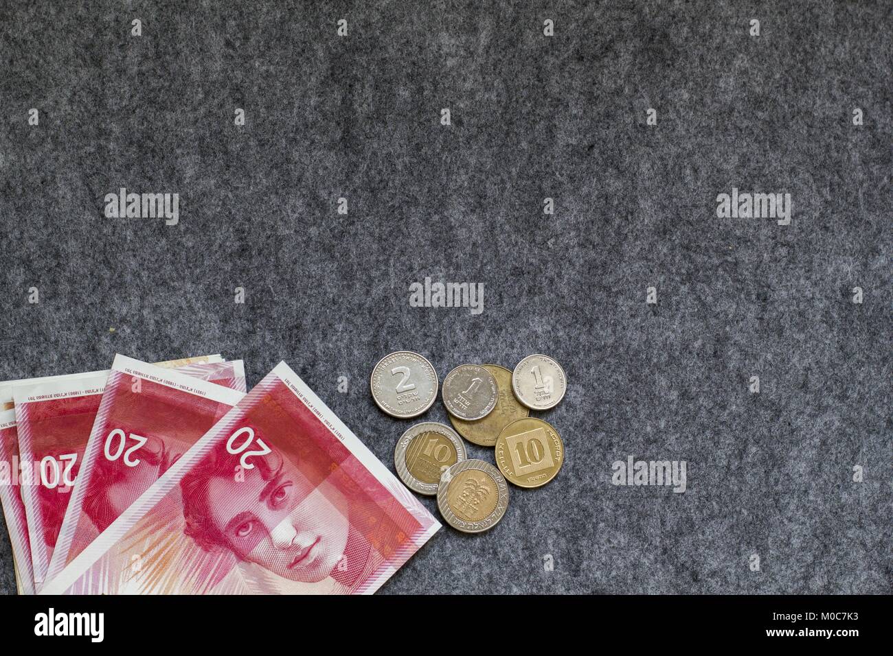 Israeli New Shekel banknotes and coins on Grey background.Copy Space ...