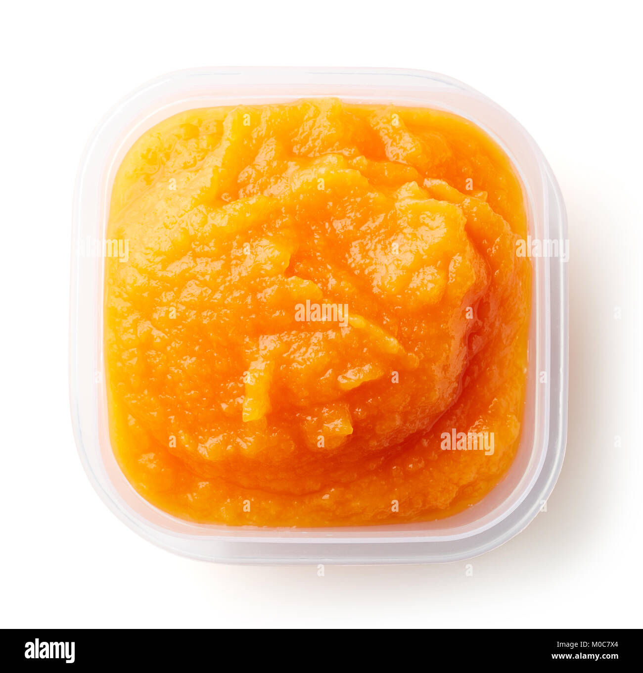 Pumpkin and carrot baby puree in plastic container isolated on white ...