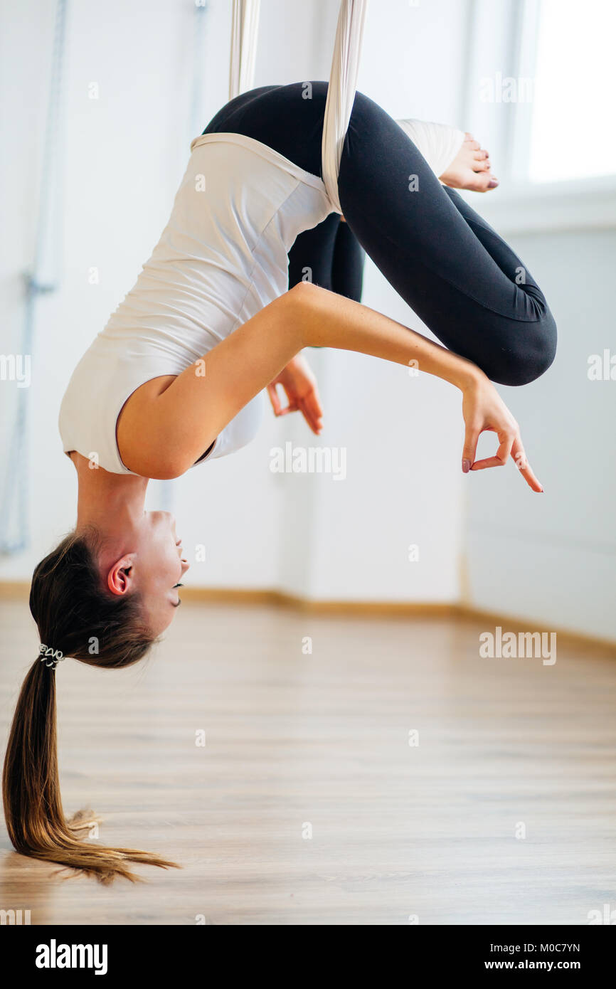 lotus pose in aero anti gravity yoga. Aerial exercises Stock Photo - Alamy