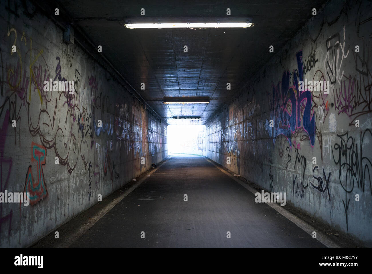 Dark underpass with graffiti on the walls Stock Photo - Alamy