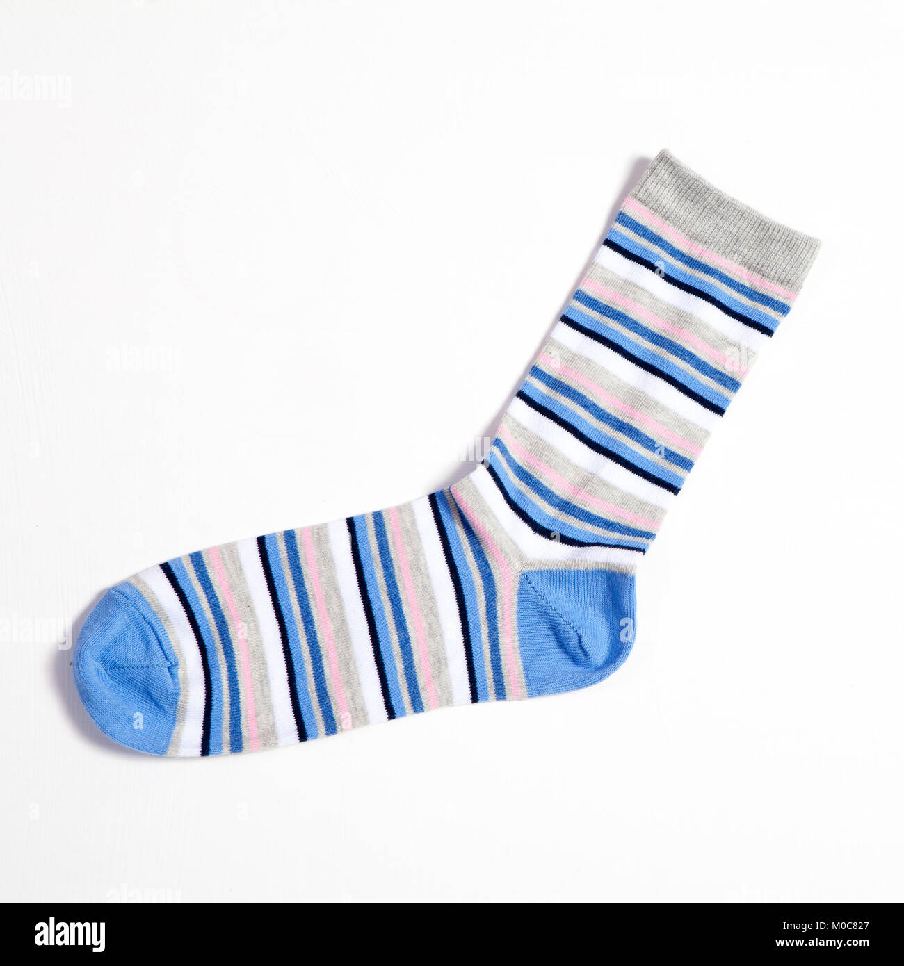 the blue striped socks on white background Stock Photo - Alamy