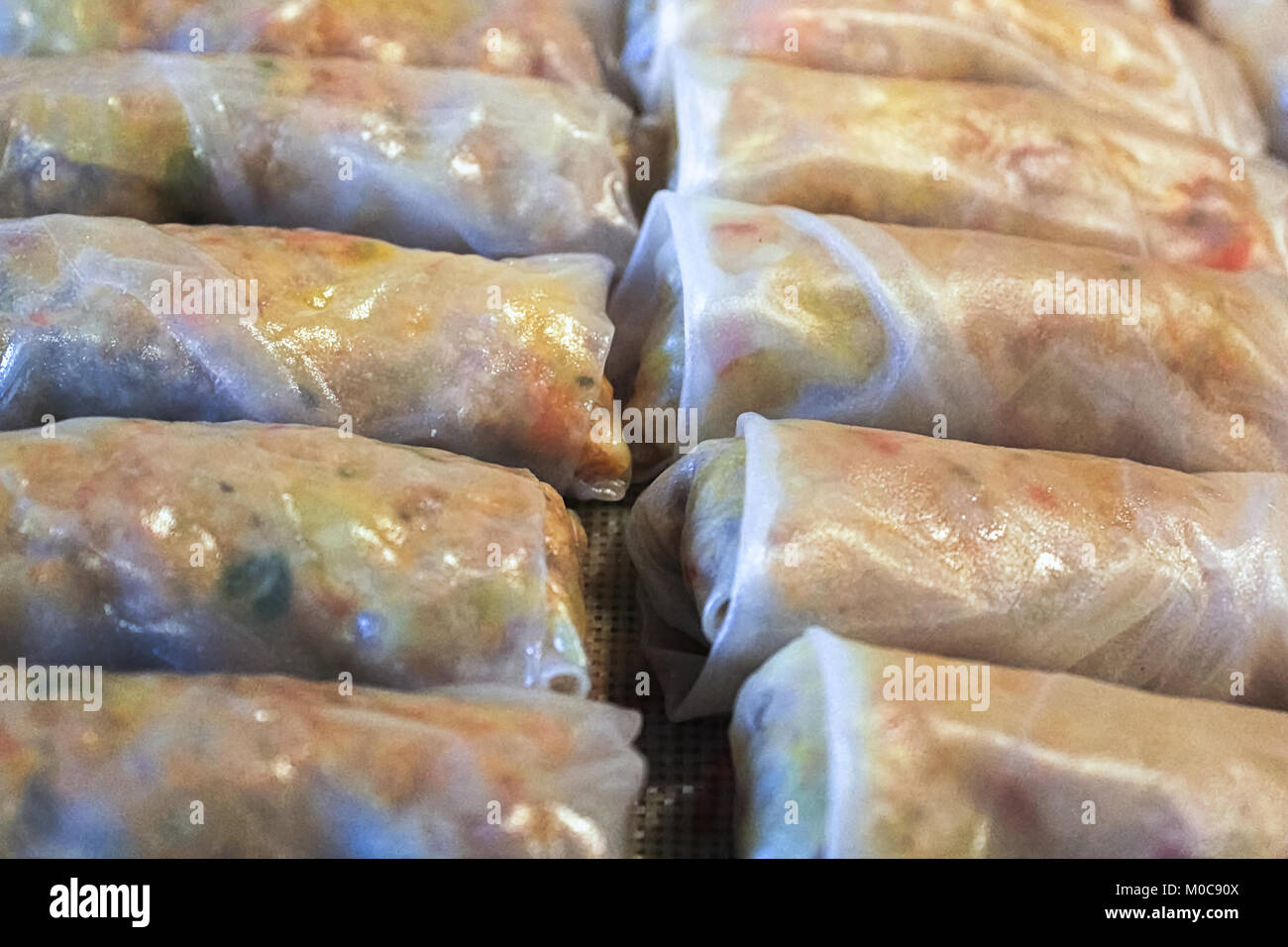 Closeup of pork spring rolls in rice wrappers Stock Photo - Alamy