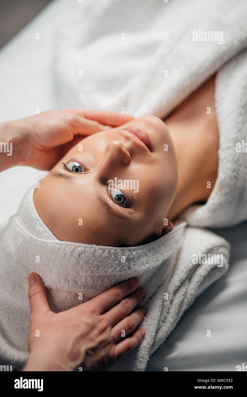 girl having spa facial massage in luxurious beauty salon Stock Photo ...