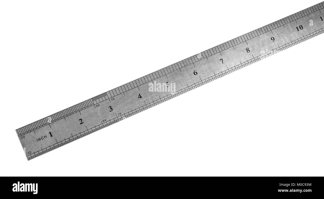 Metal ruler in centimeters or inches. Measuring tool on the white ...