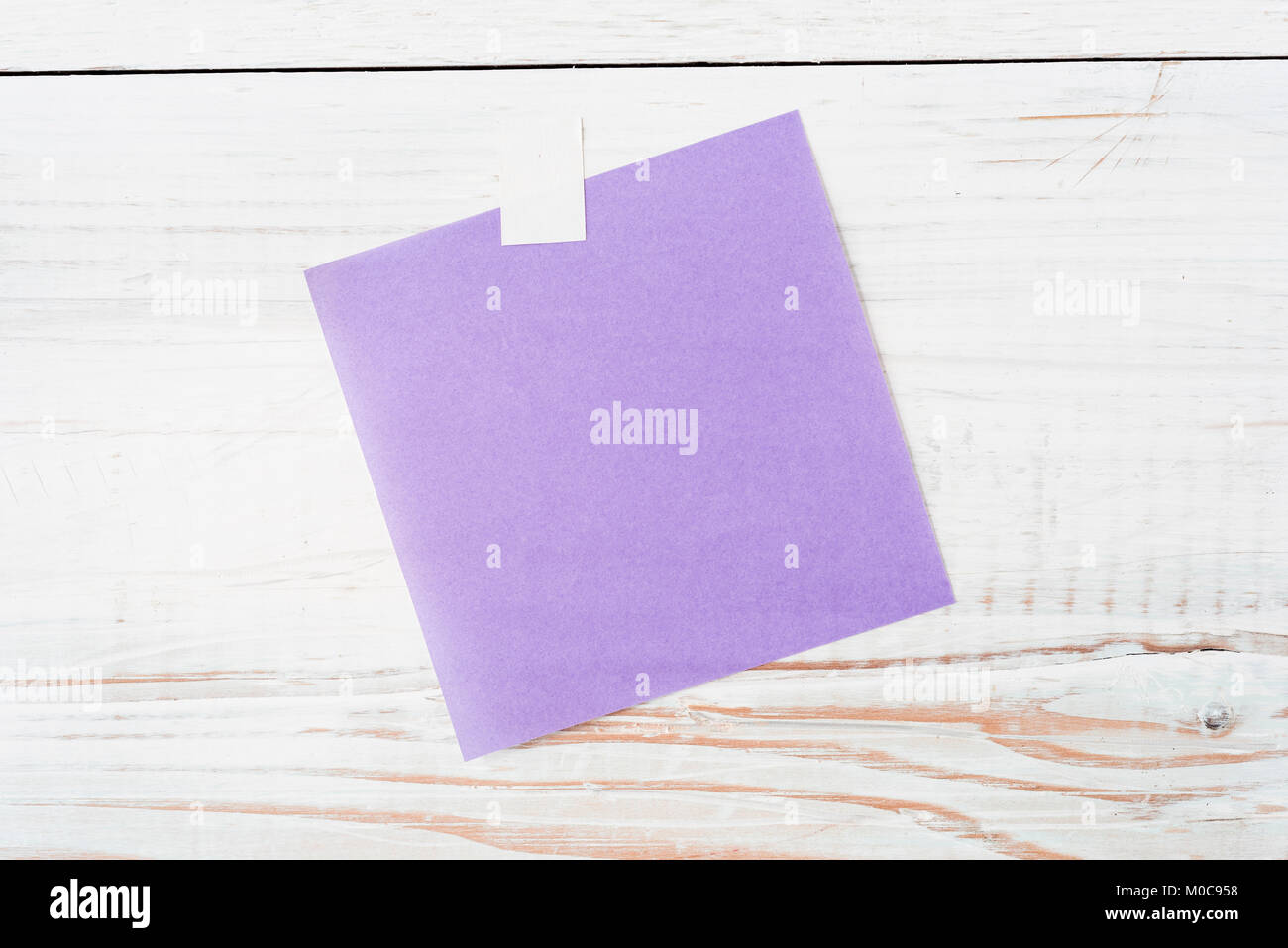 blank piece of purple note paper on rustic white wood background ready ...