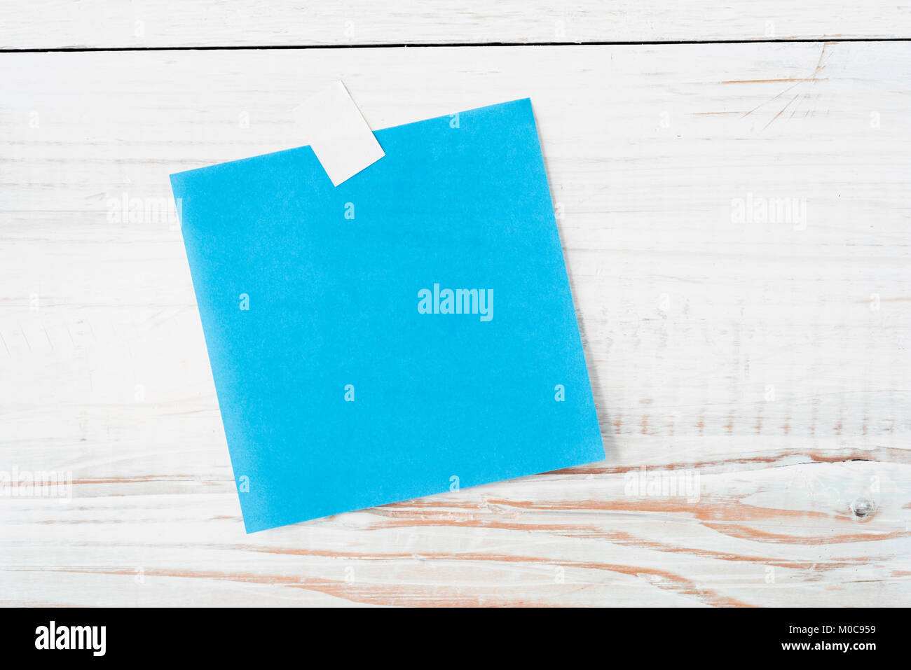 blank piece of blue note paper on rustic white wood background ready ...