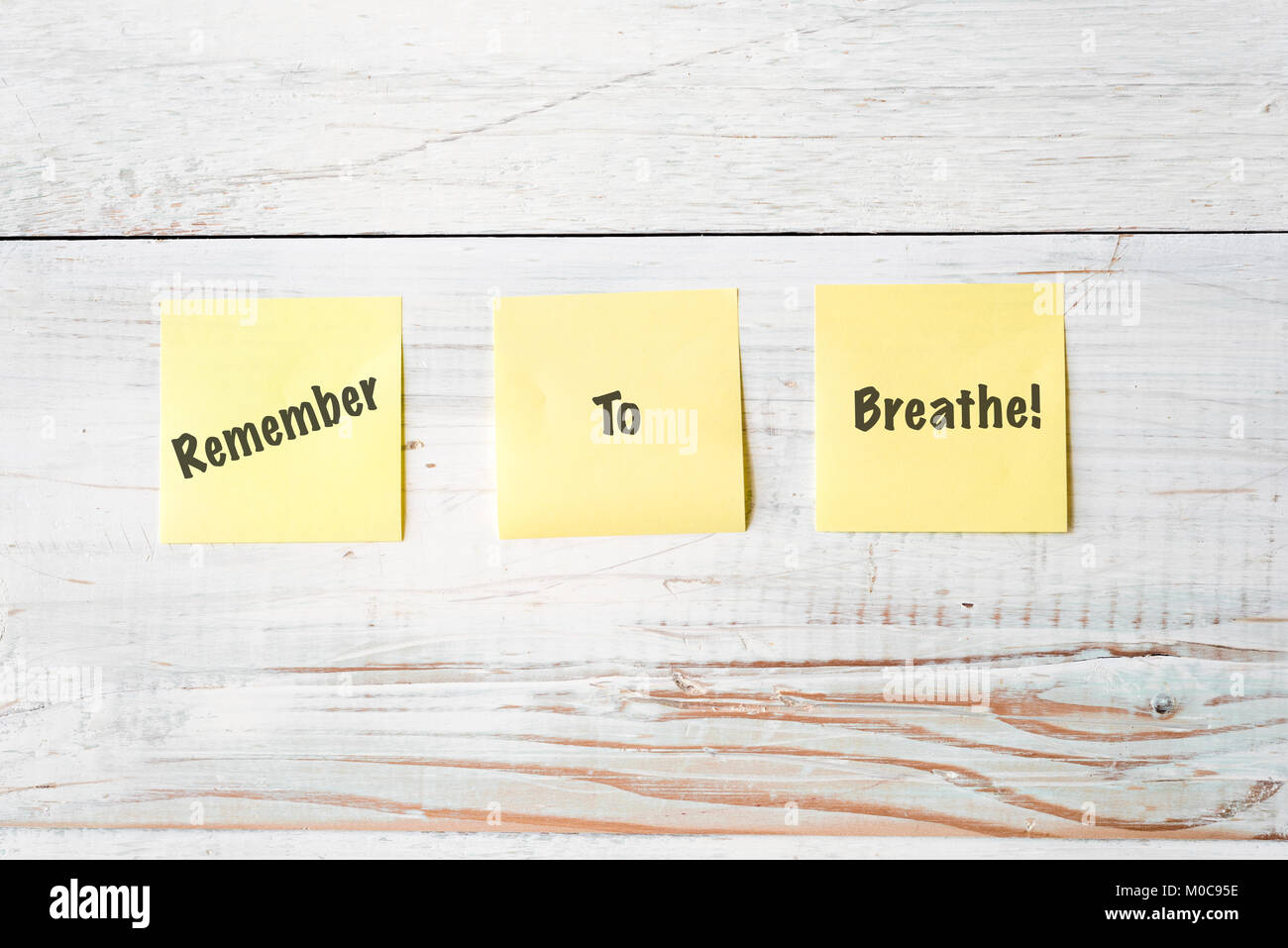 three yellow Post It notes with message Remember To Breathe! against ...