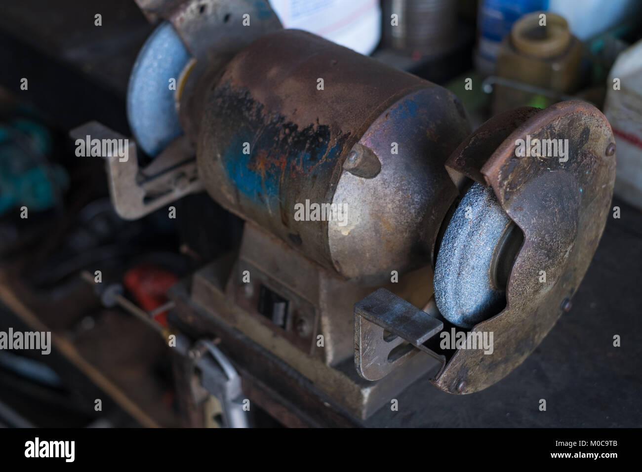Circular wire grinding brush machine. Steel polisher in garage Stock ...