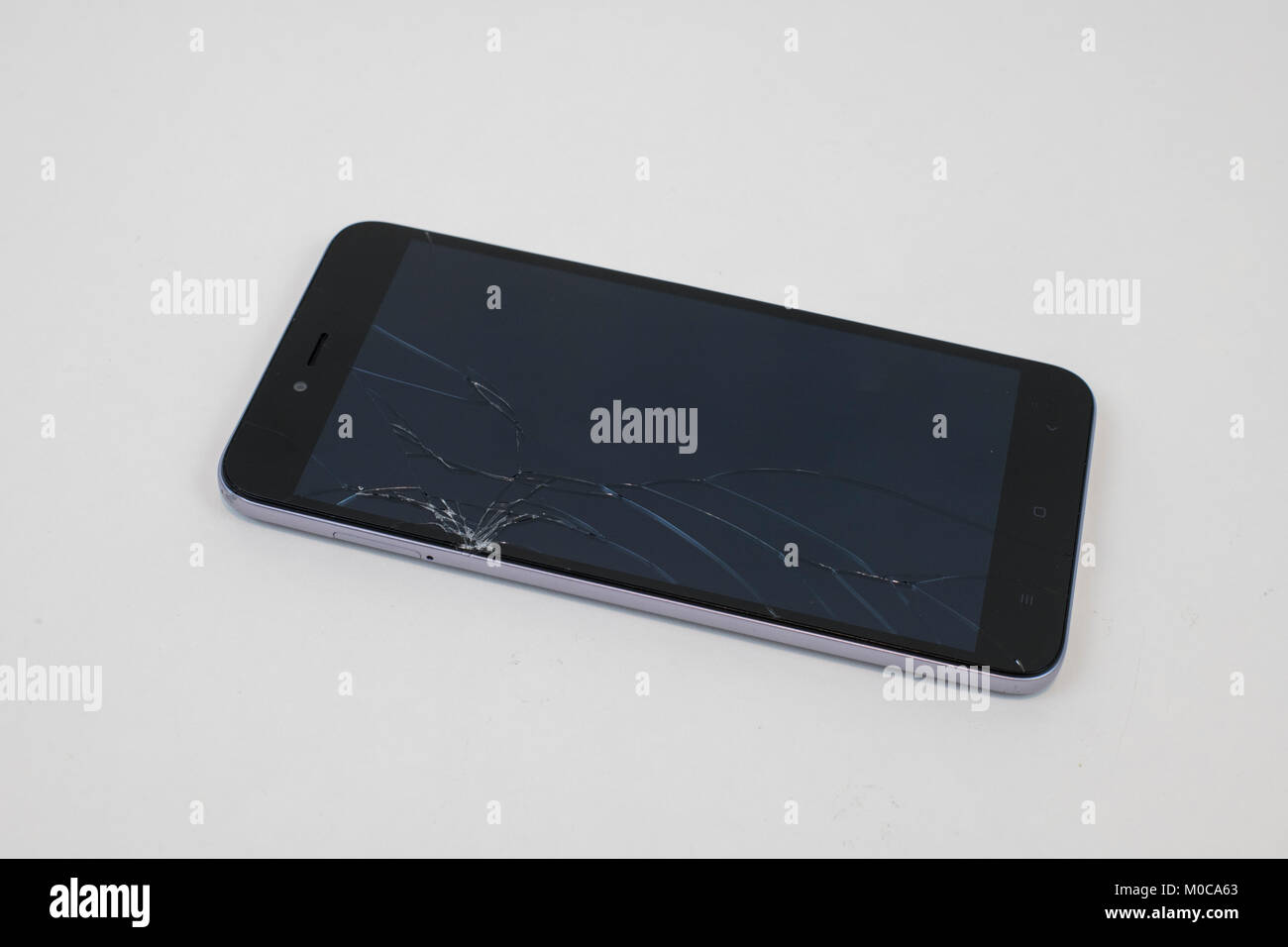 Broked screen on mobile phone unbranded Stock Photo - Alamy