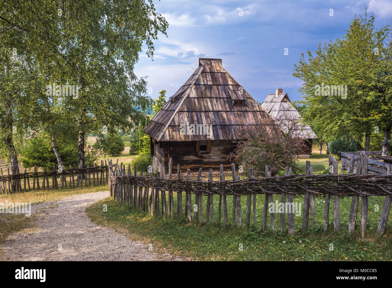 Traditional wooden cottages in Ethnographic heritage park called Old ...