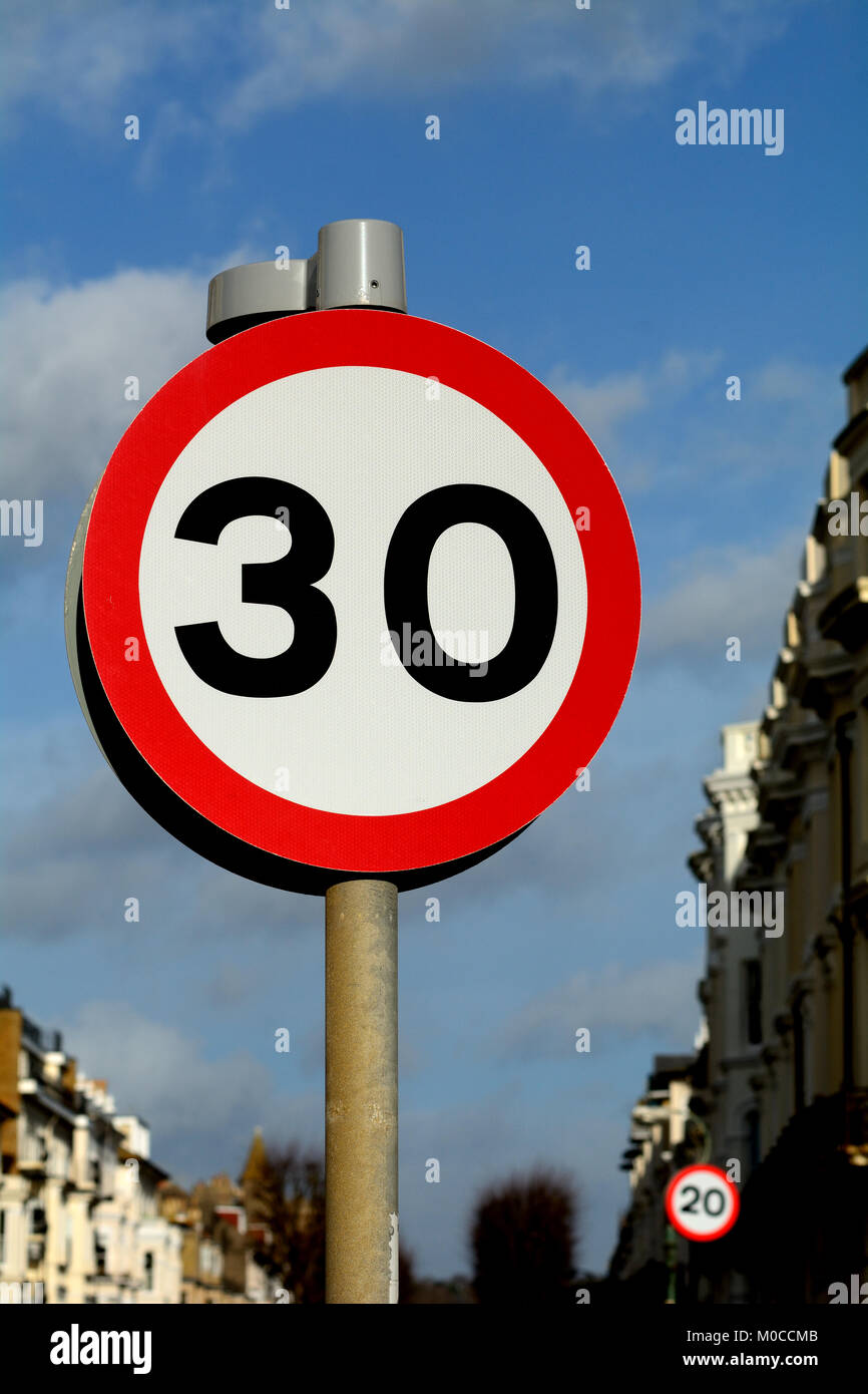 A road sign indicating a 30 mph speed limit Stock Photo - Alamy