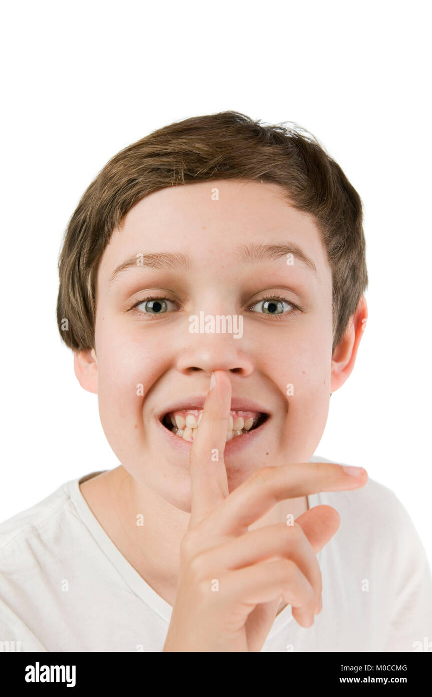 Wide-angle close-up of a young teenager holding his index finger in ...