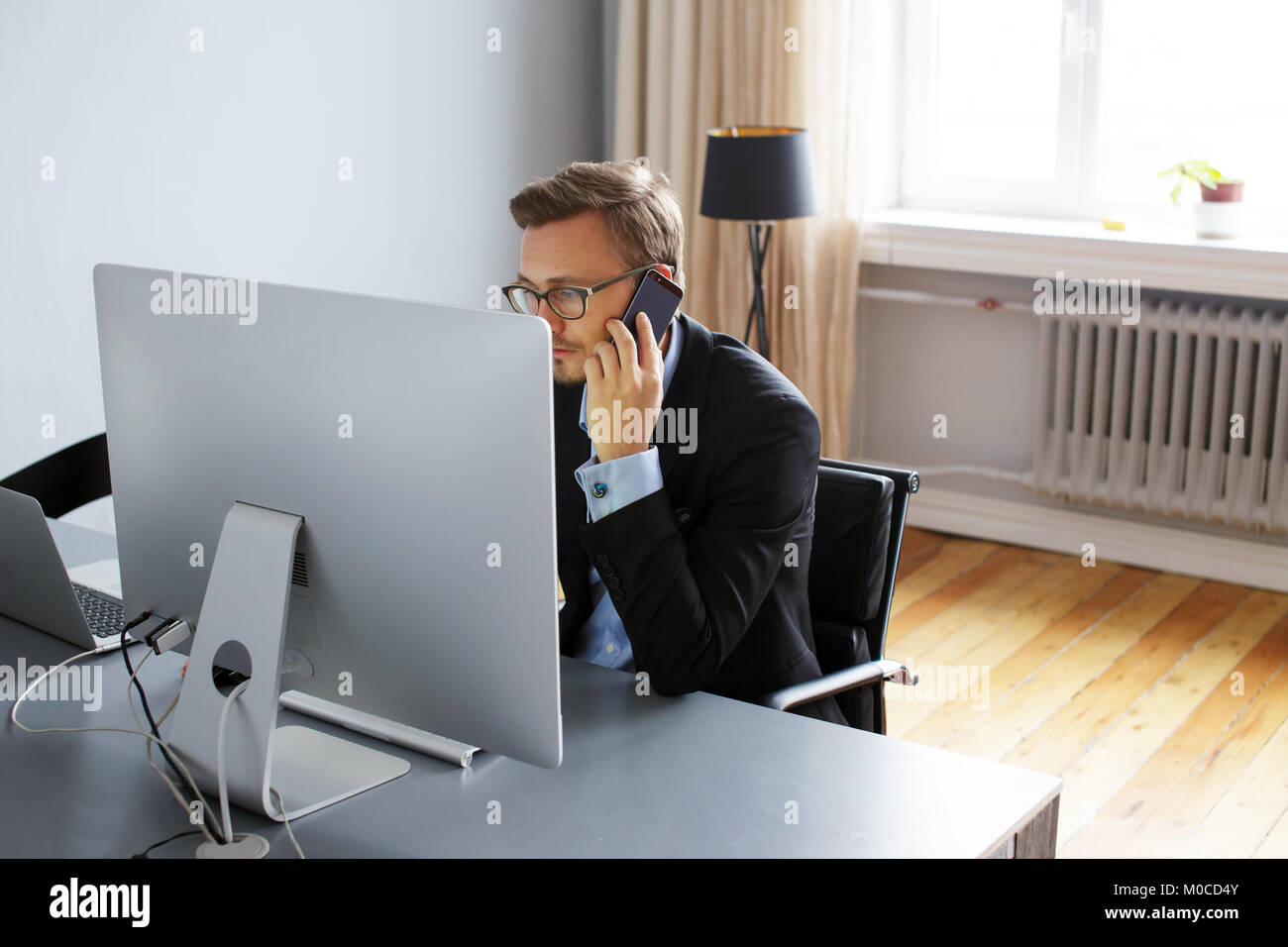 Handsome business man working with computer Stock Photo - Alamy