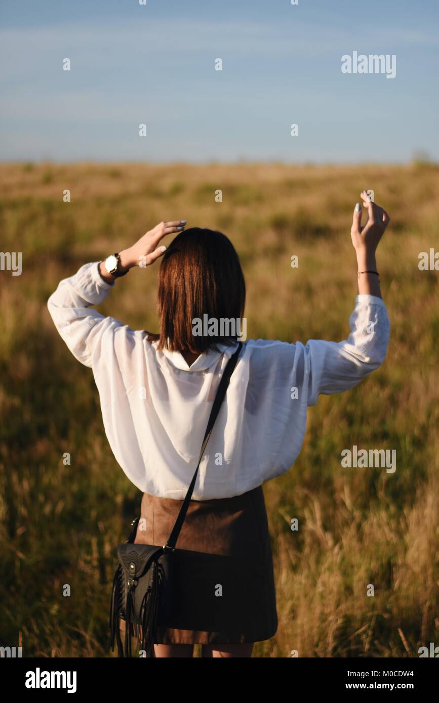 girl in grass field Stock Photo - Alamy