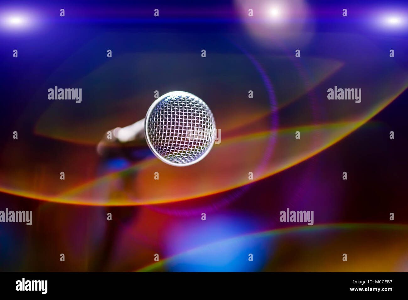 Public performance on stage Microphone on stage against a background of ...