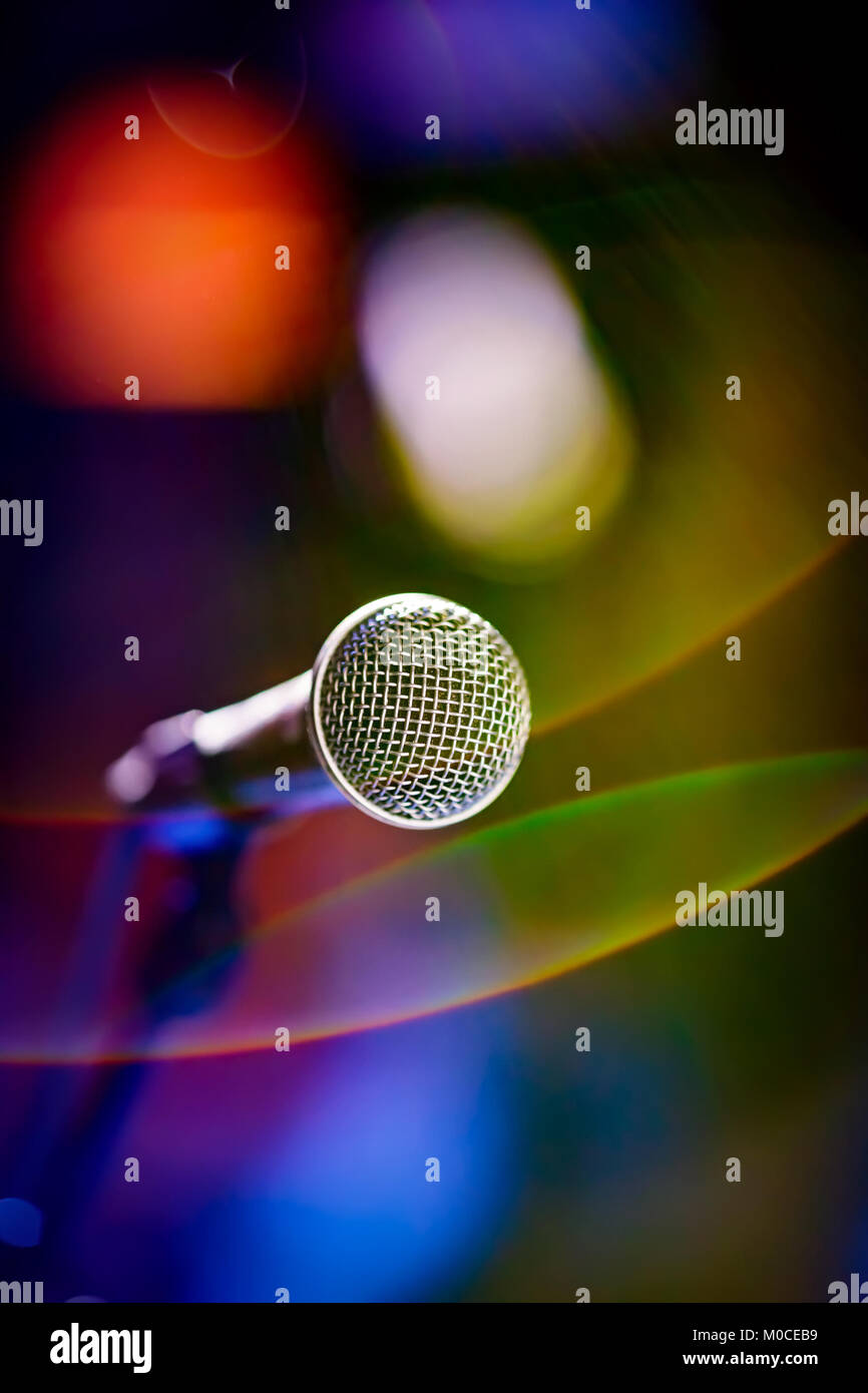 Public performance on stage Microphone on stage against a background of ...