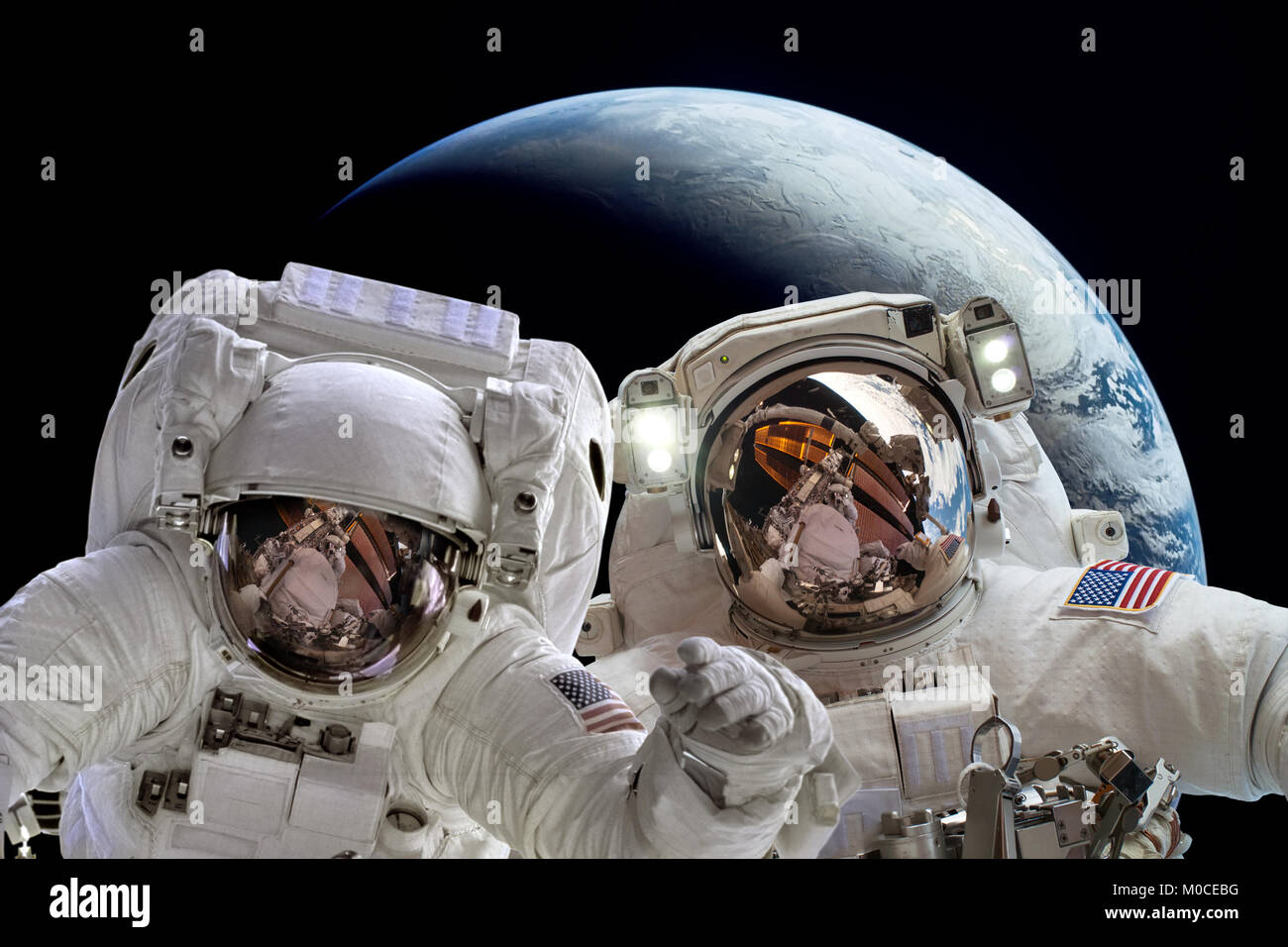 Astronaut in outer space against the backdrop of the planet earth ...