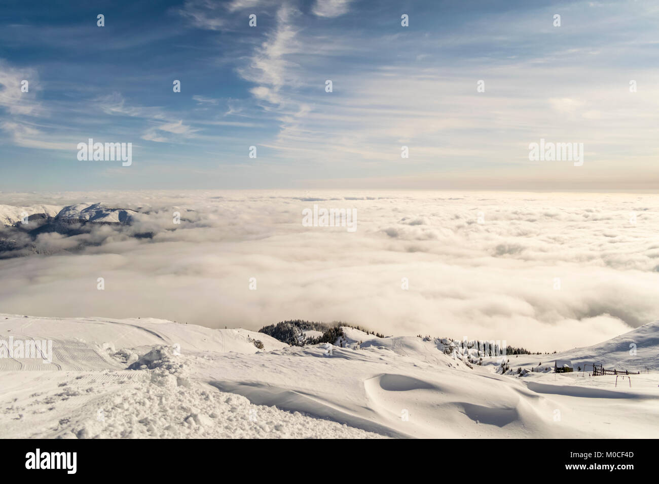 peaks of mountains above the clouds. Winter landscape Stock Photo - Alamy
