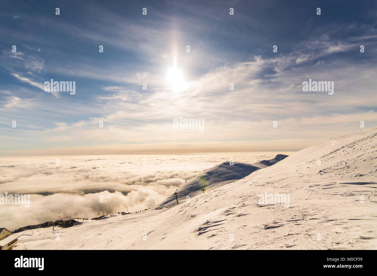 peaks of mountains above the clouds. Winter landscape Stock Photo - Alamy