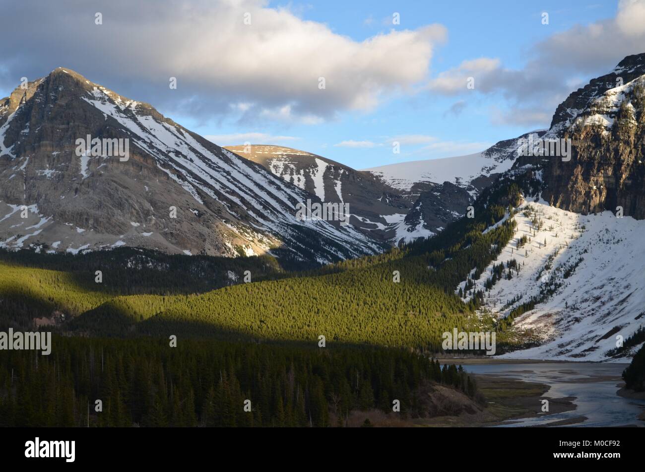 As the sun begins to go down, it casts a shadow over the valley and the ...