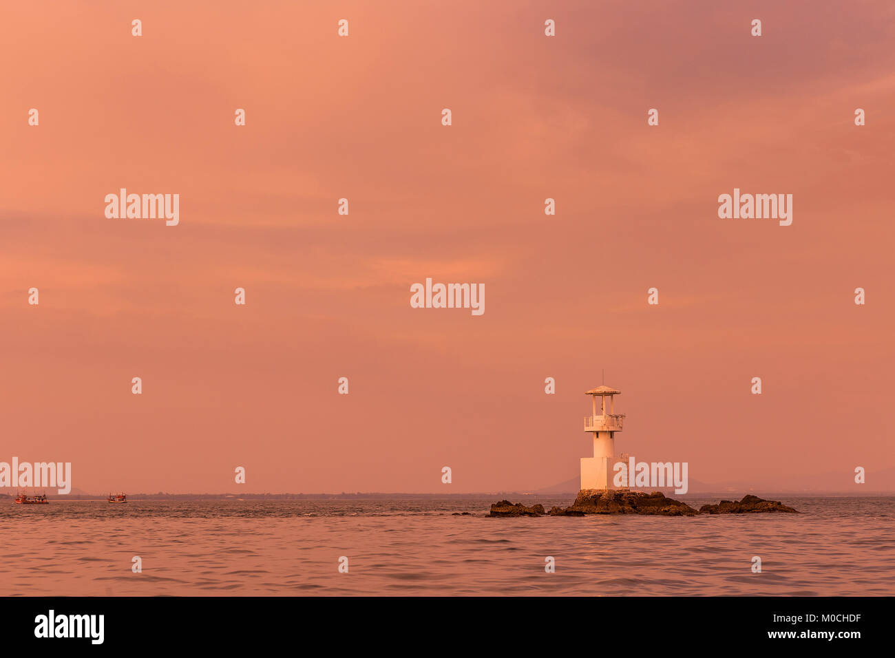 traditional style lighthouse on cape in the sea with beatiful light ...