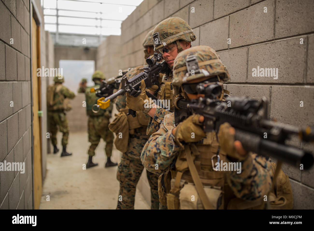 U.S. Marines with 1st Combat Engineer Battalion provides rear security ...