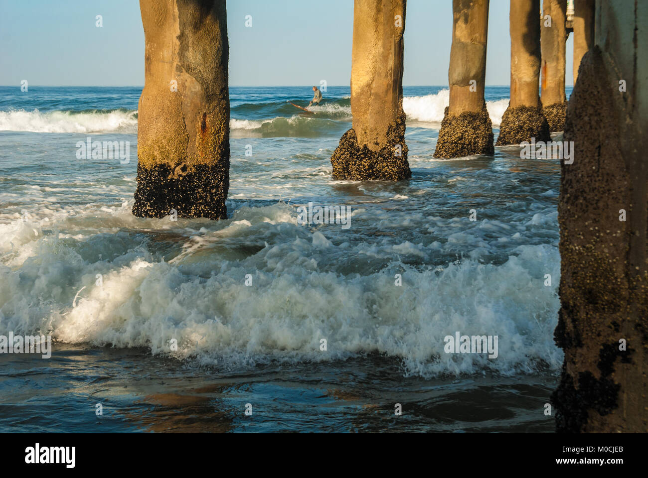 Early morning surfing at Manhattan Beach pier in Los Angeles County ...