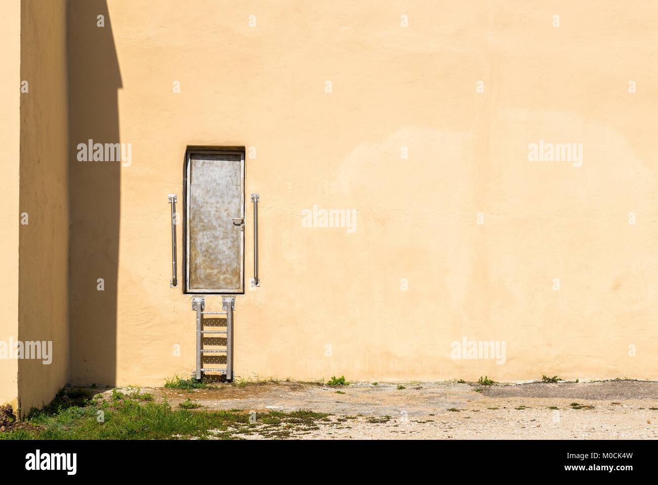 Rusty iron door with ladder and handrail Stock Photo - Alamy