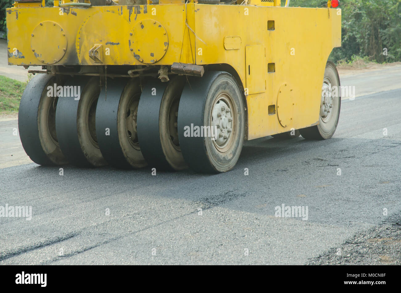 Road roller machine works on the fresh asphalt, Asphalt road ...