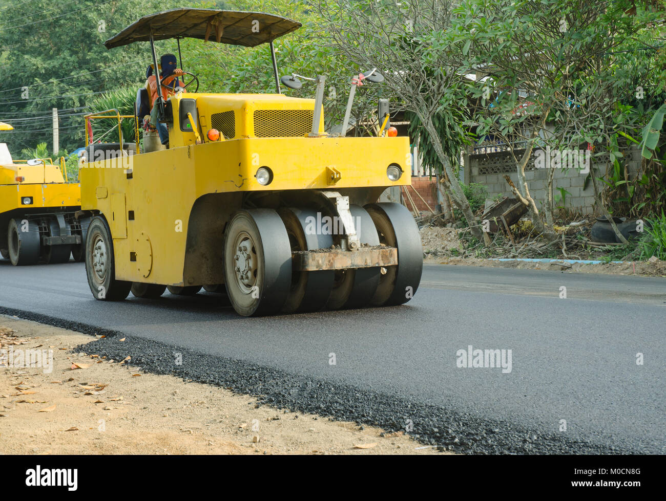 Road roller machine works on the fresh asphalt, Asphalt road ...