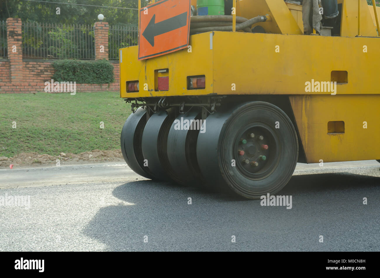 Road roller machine works on the fresh asphalt, Asphalt road ...