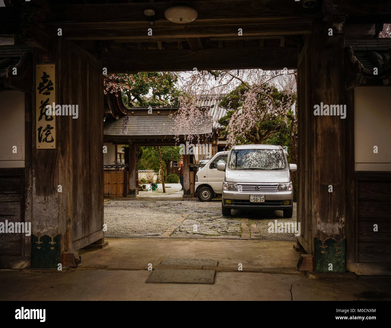 Nara, Japan - Apr 4, 2014. Ancient wooden house at cherry blossom in ...