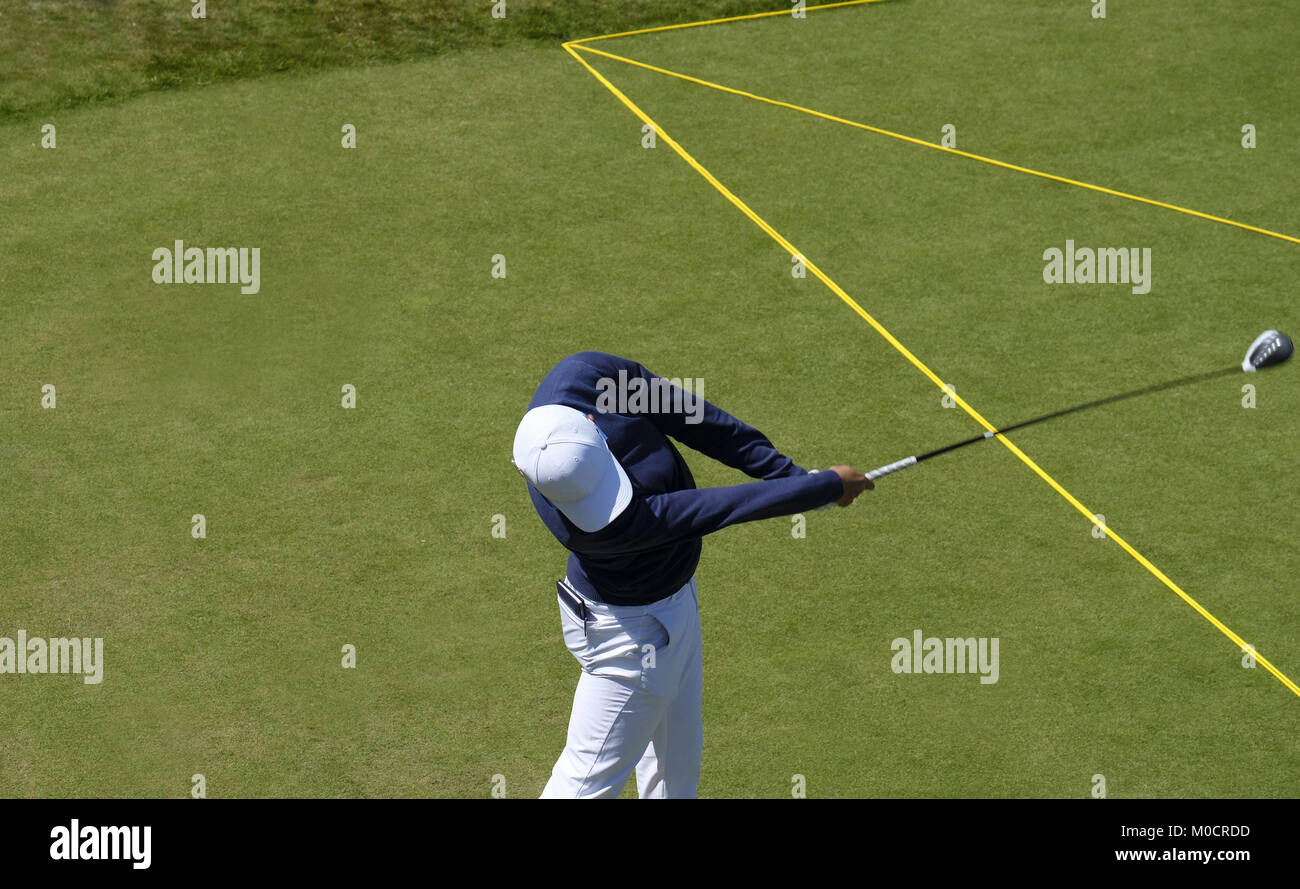 Golfer at follow through position Stock Photo - Alamy