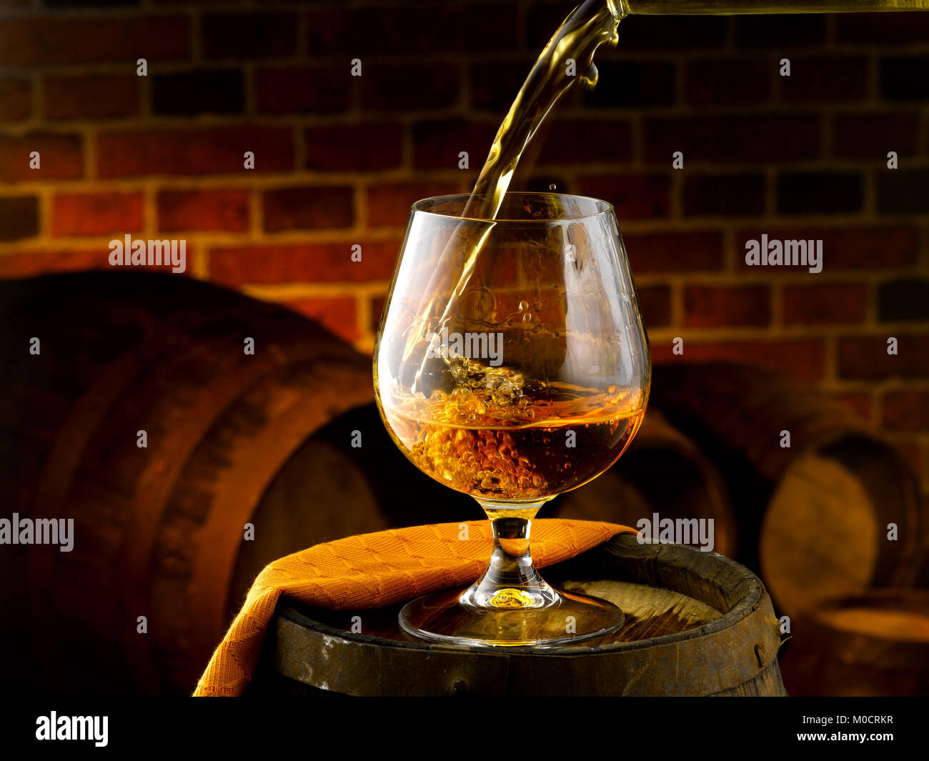 cognac poured in a glass Stock Photo - Alamy