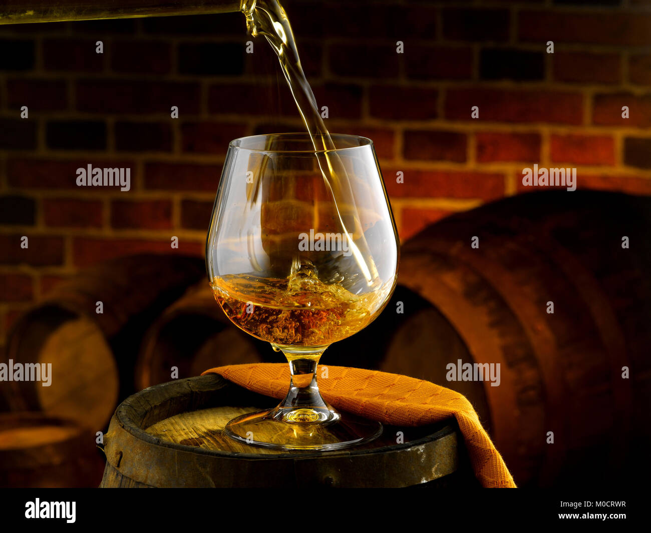 cognac poured in a glass Stock Photo - Alamy