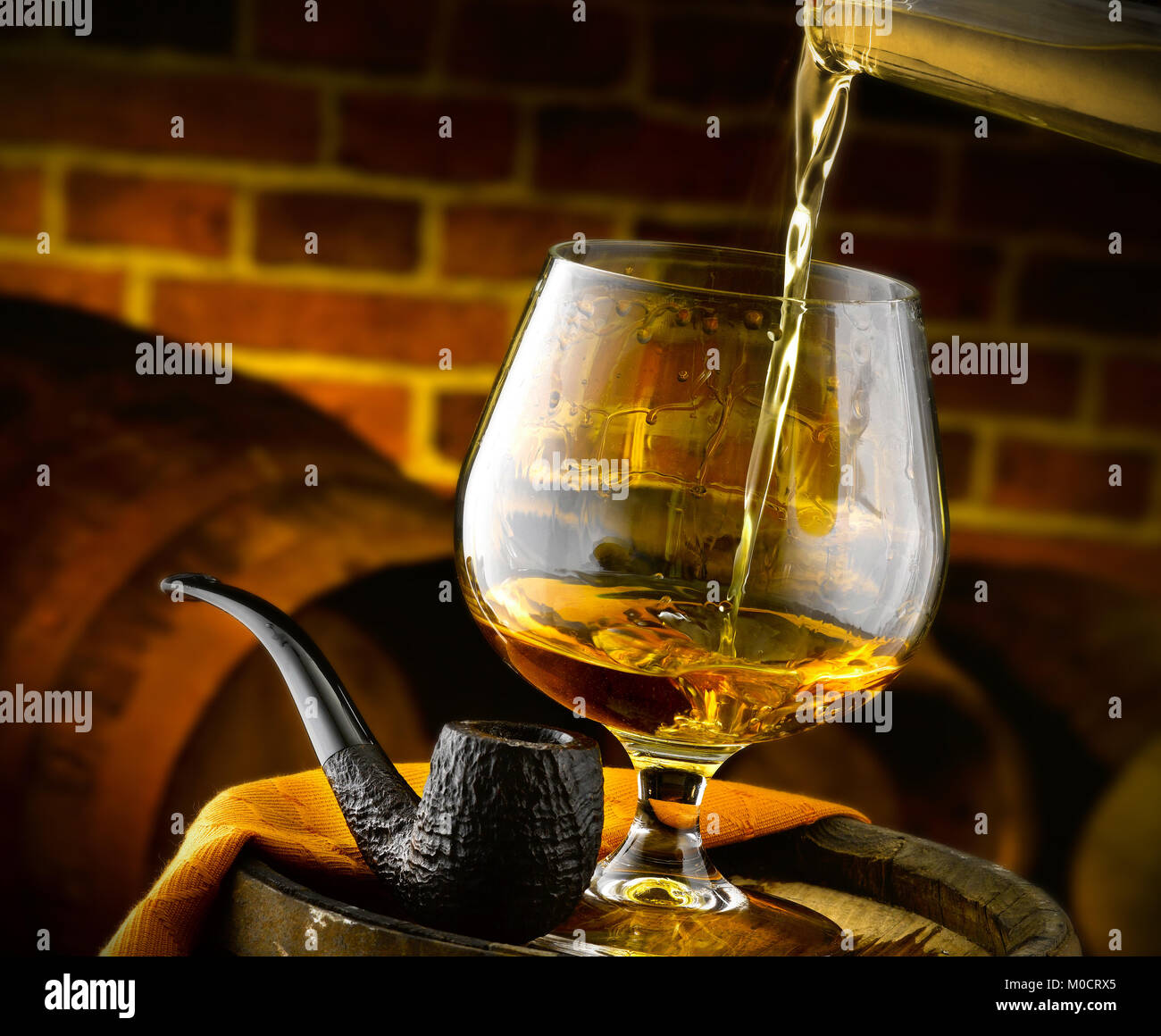 cognac poured in a glass Stock Photo - Alamy