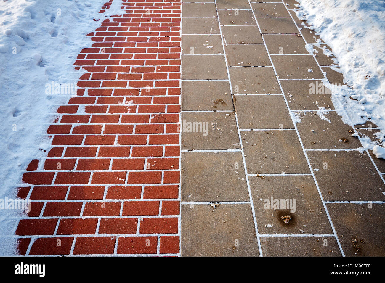 Concrete tiles paving texture with a little bit of snow Stock Photo - Alamy